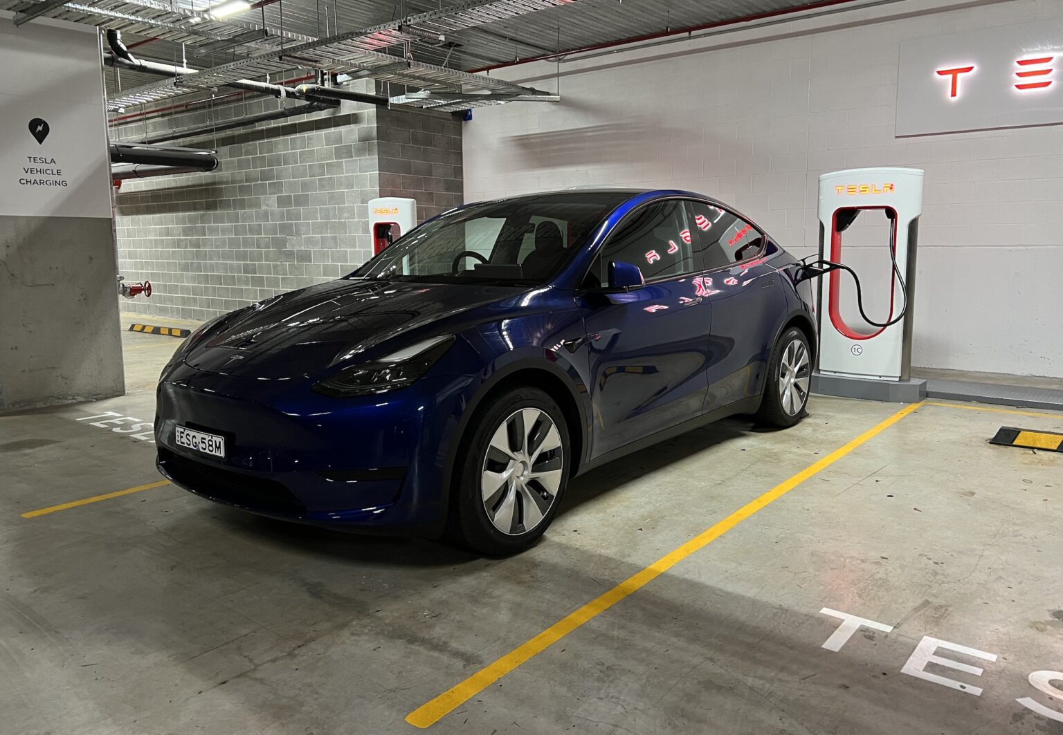Charging a Tesla Model Y at a new V3 Supercharger - EV Central
